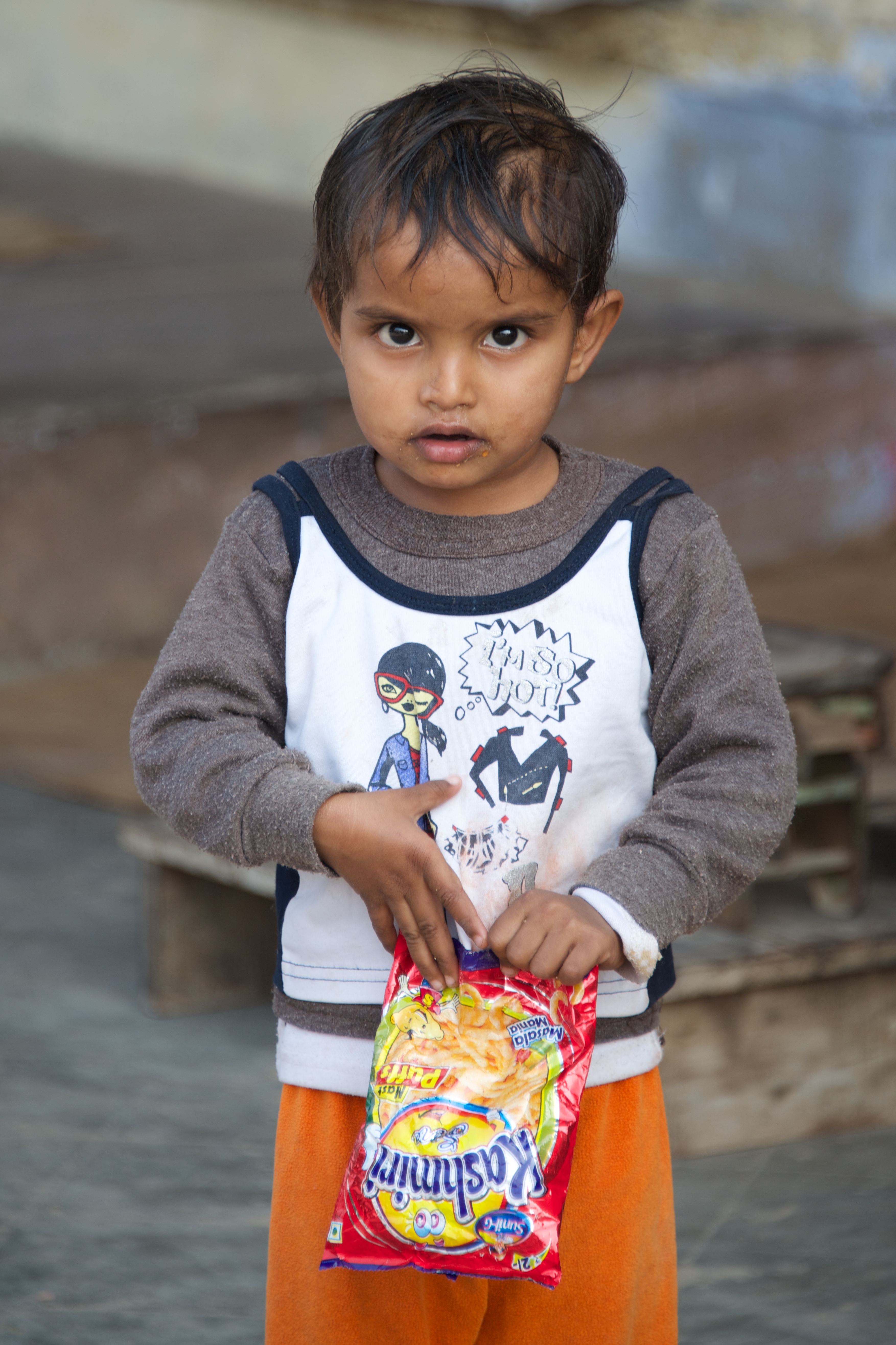 Indian boy with packet of crisps - Nick Dale - Private Tutor