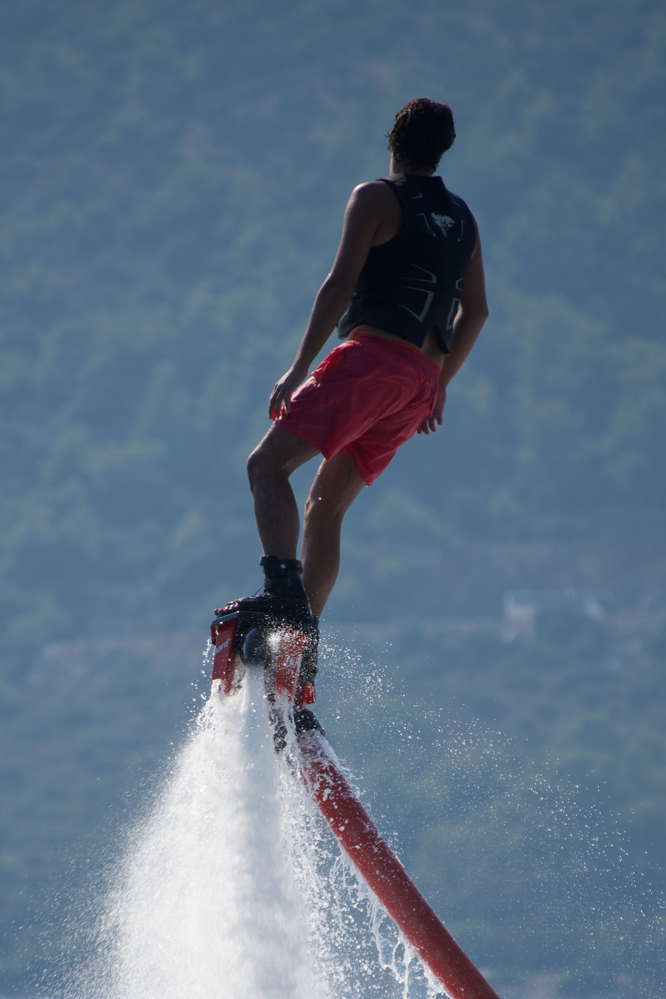 Close-up of Flyboarder leaning backwards before turn | Nick Dale ...