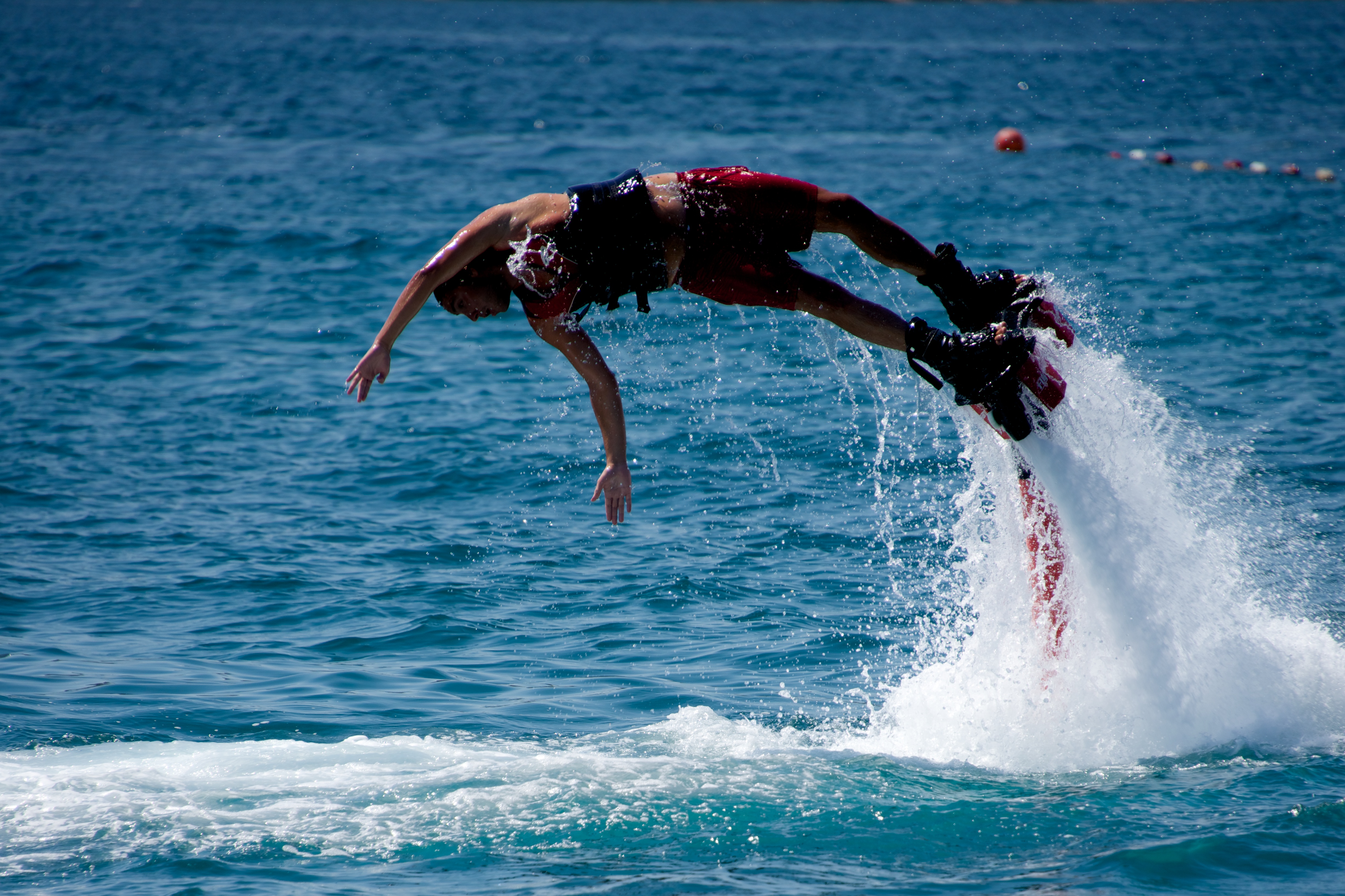 Flyboarder in red twisting horizontally into dive - Nick Dale - Private ...