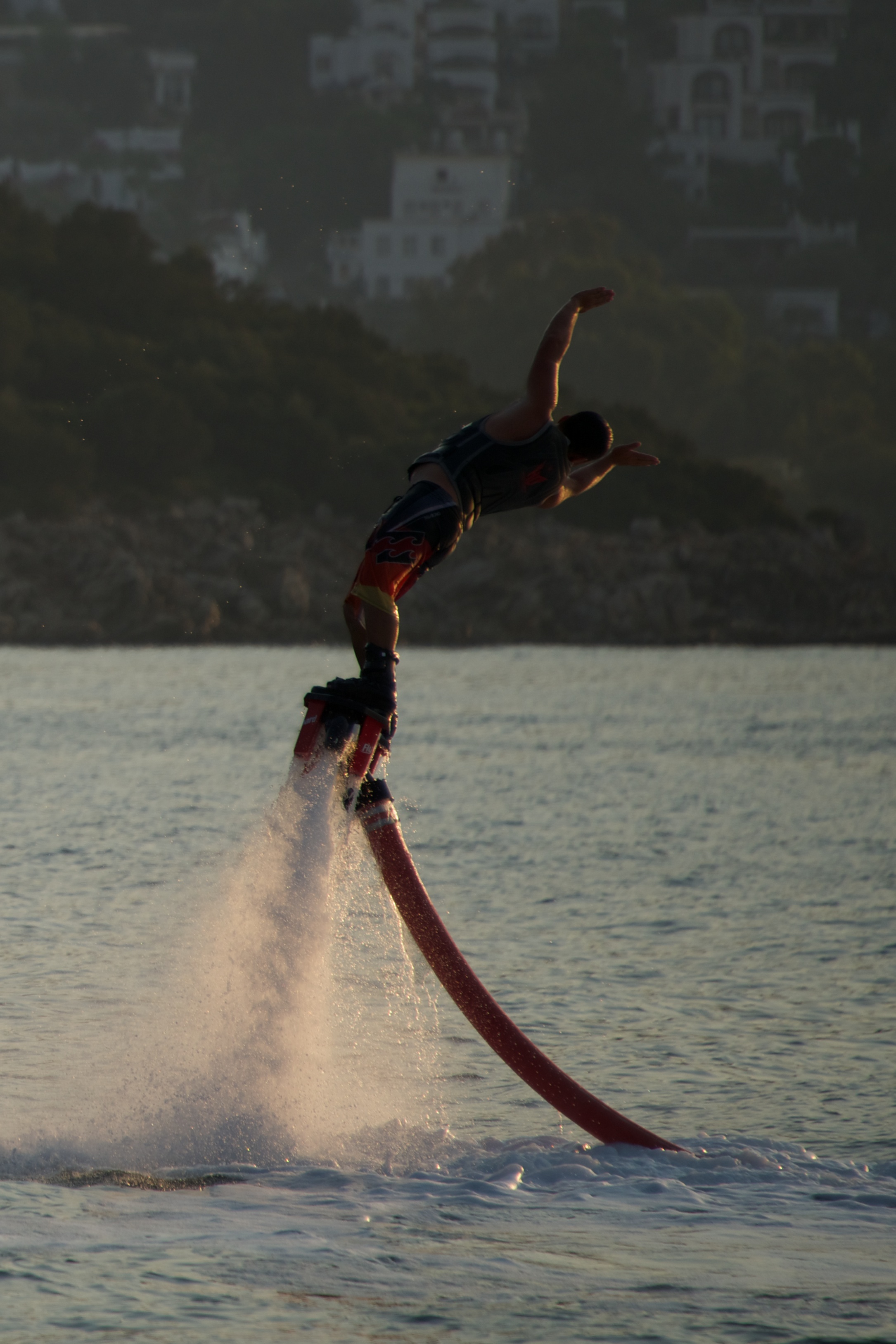 Flyboarder leaning over backwards to start dive | Nick Dale – Private Tutor